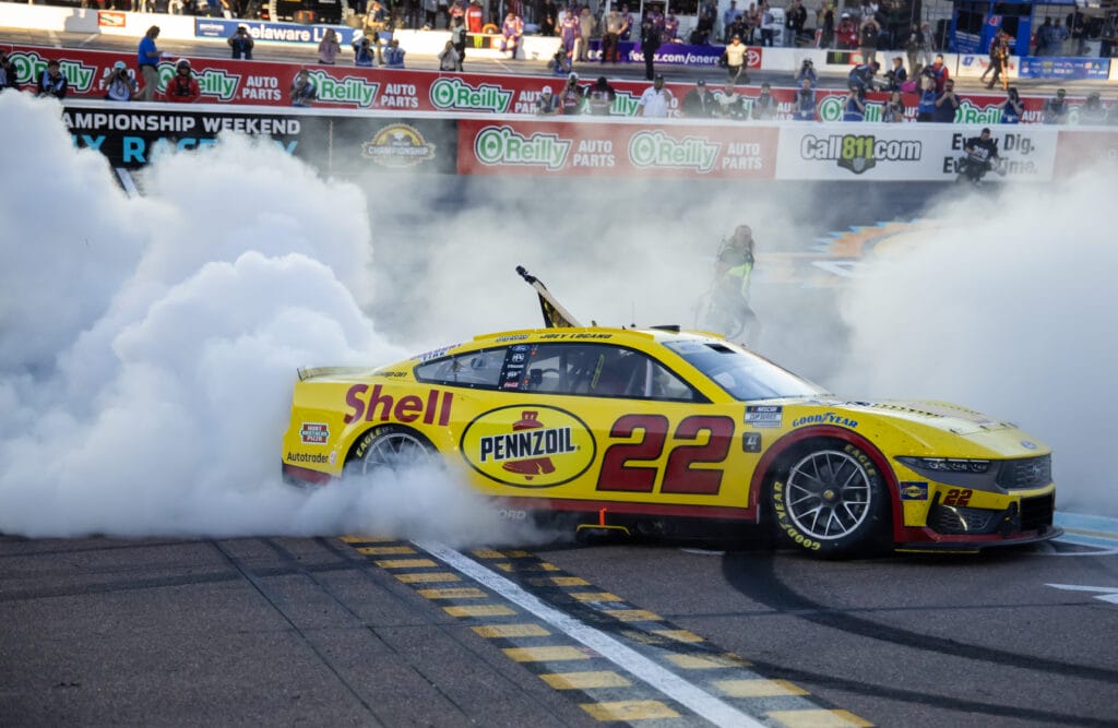 Three times a champ: Logano wins NASCAR title race